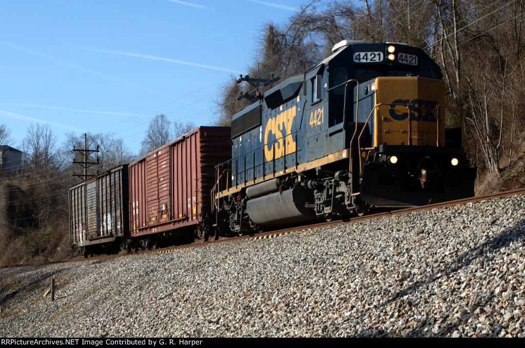 609 - CSXT 4421 with two cars westbound on the local H74415